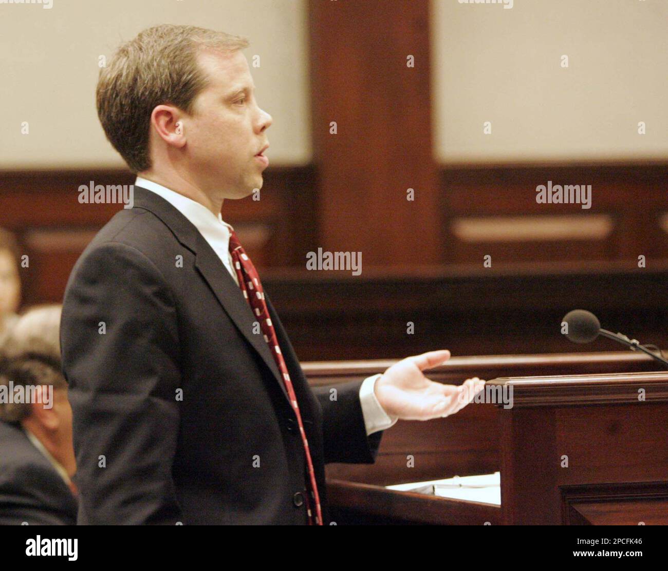 Creighton Waters, Assistant Attorney General, gestures as he argues ...