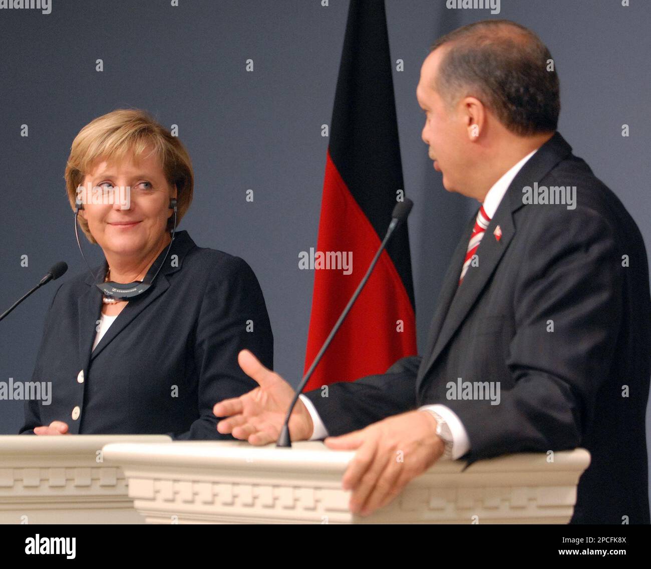German Chancellor Angela Merkel, left, looks toward her Turkish ...