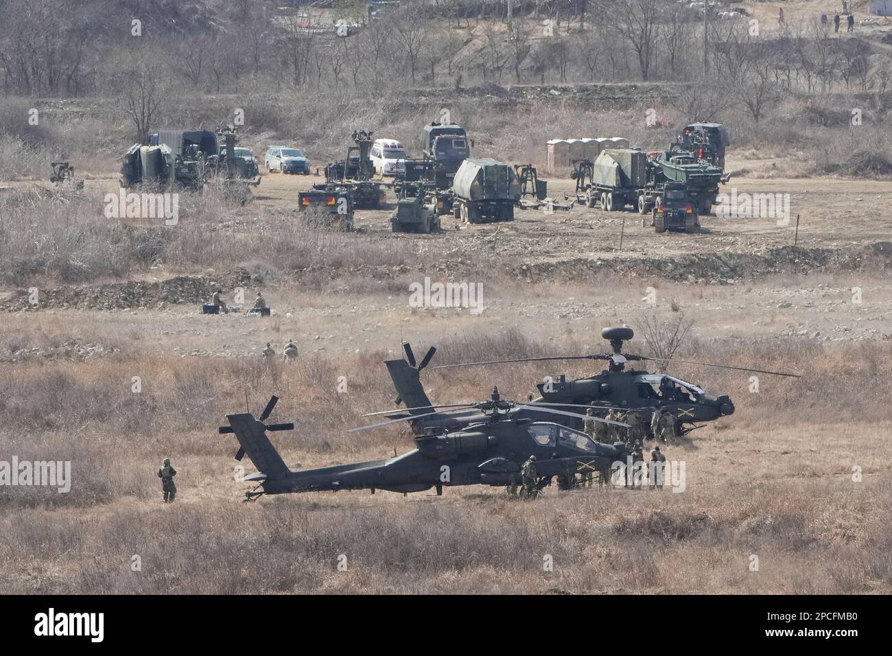 FILE - U.S. Army Apache helicopters park at a training field in ...