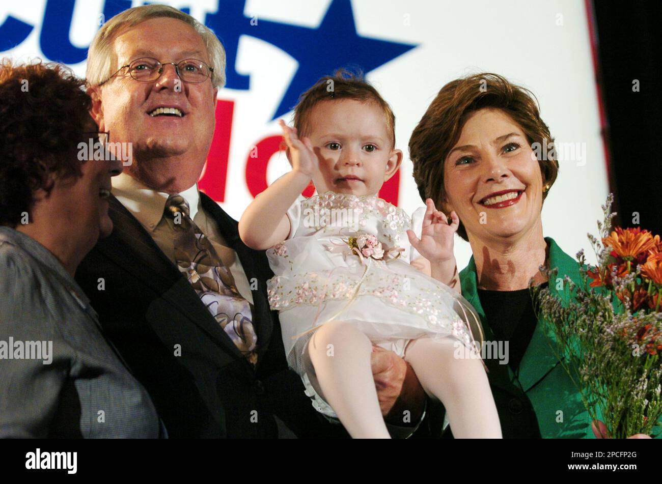 First lady Laura Bush poses with Rep. Curt Weldon, R-Pa., and his ...
