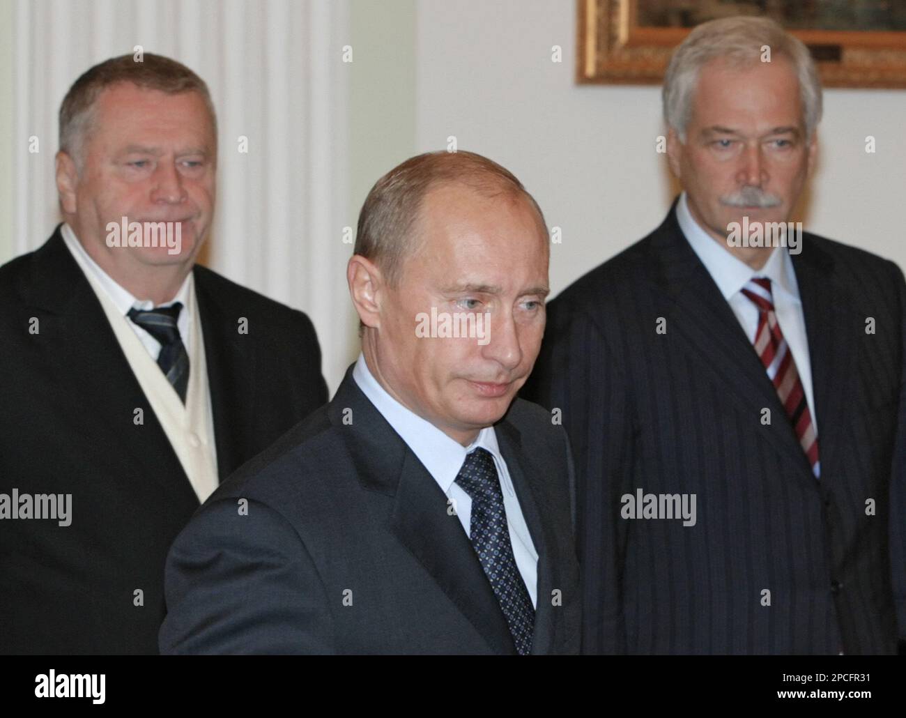 Russian President Vladimir Putin, foreground, welcomes parliament ...