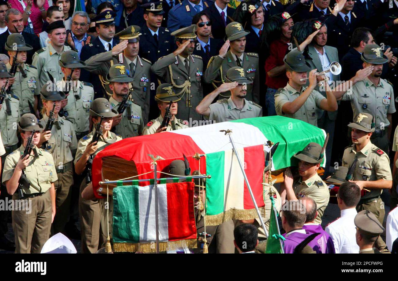 Italian members of the armed forces salute the coffin of Italian Army ...