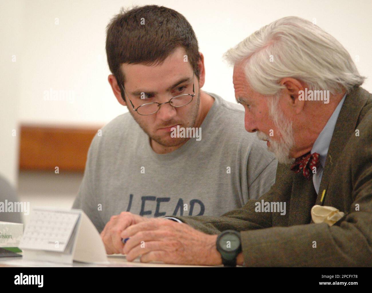 Defendant, Aaron Bassett, 28, of Enfield, N.H., left, listens to his ...