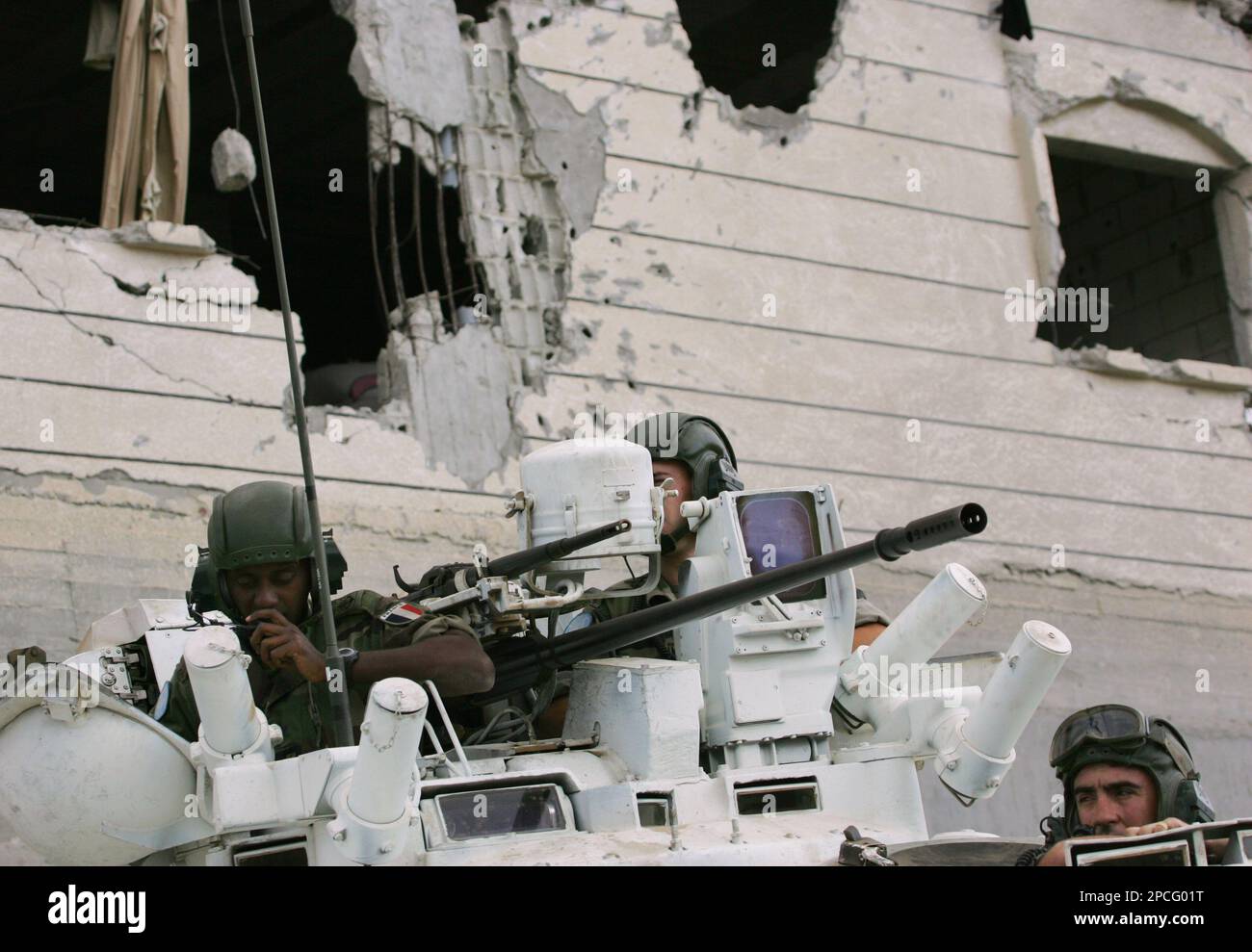 French U.N. peacekeepers are seen atop their armoured personnel carrier ...