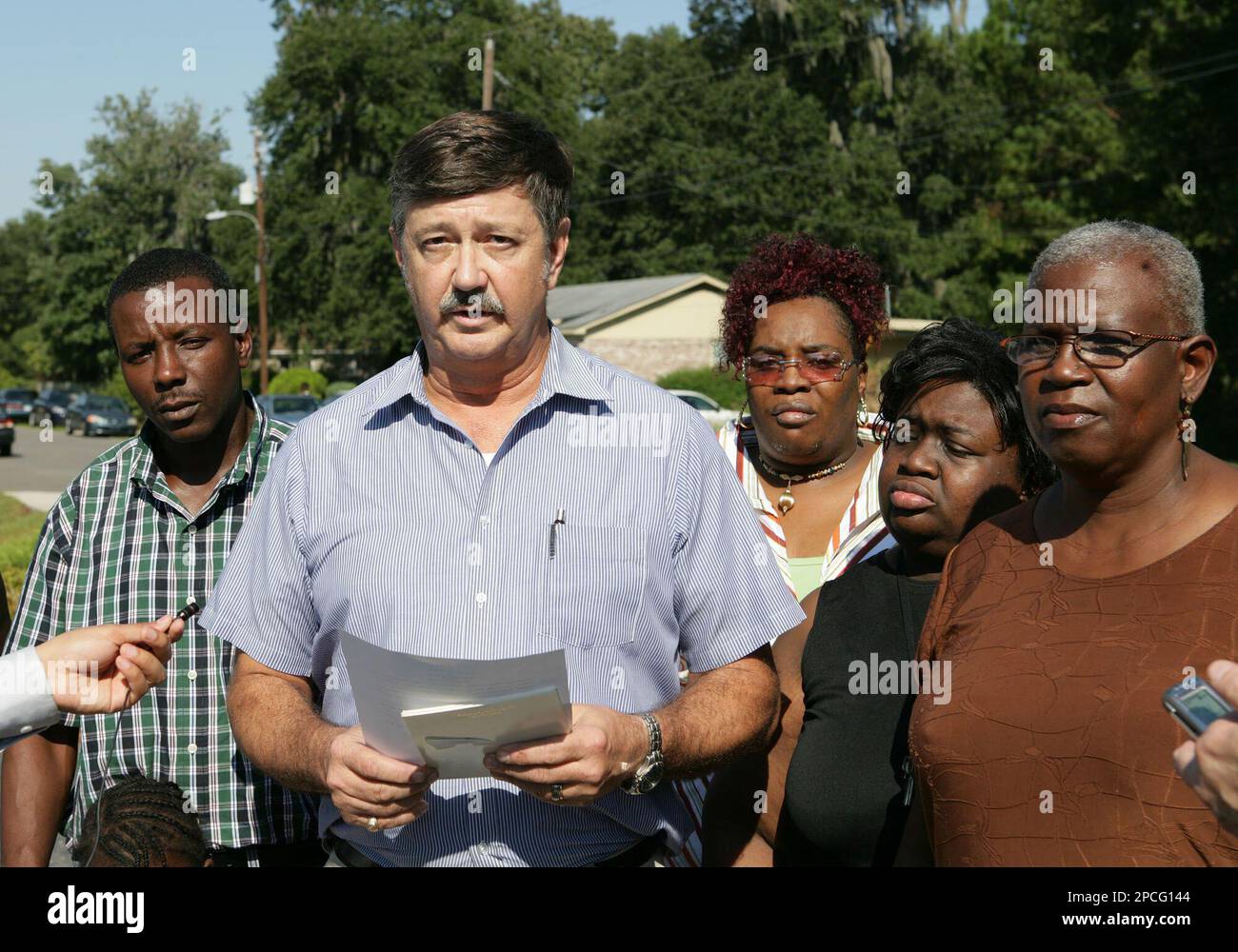 Gene Fanning, center, brother-in-law of Detra Rainey Simmons, is ...