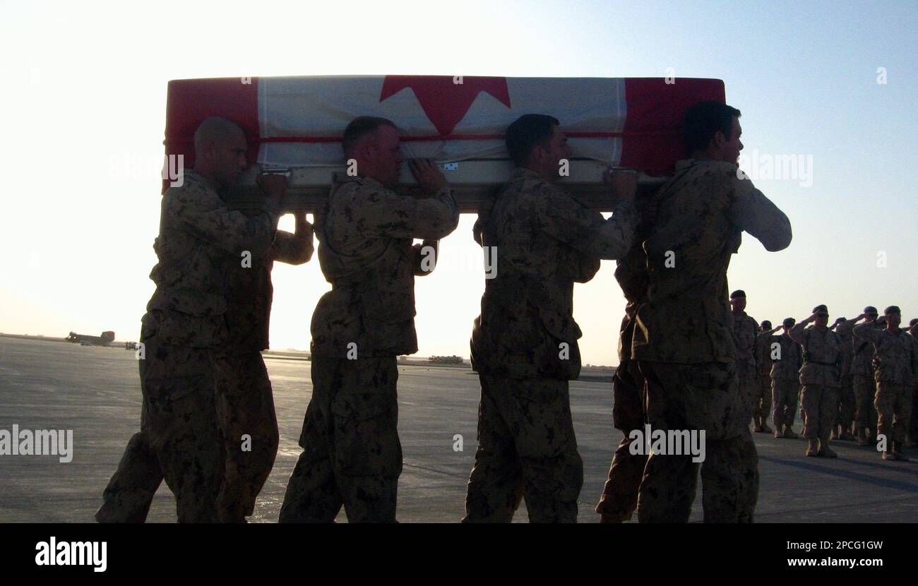 Canadian soldiers load the remains of Pte. Josh Klukie onto a Hercules ...