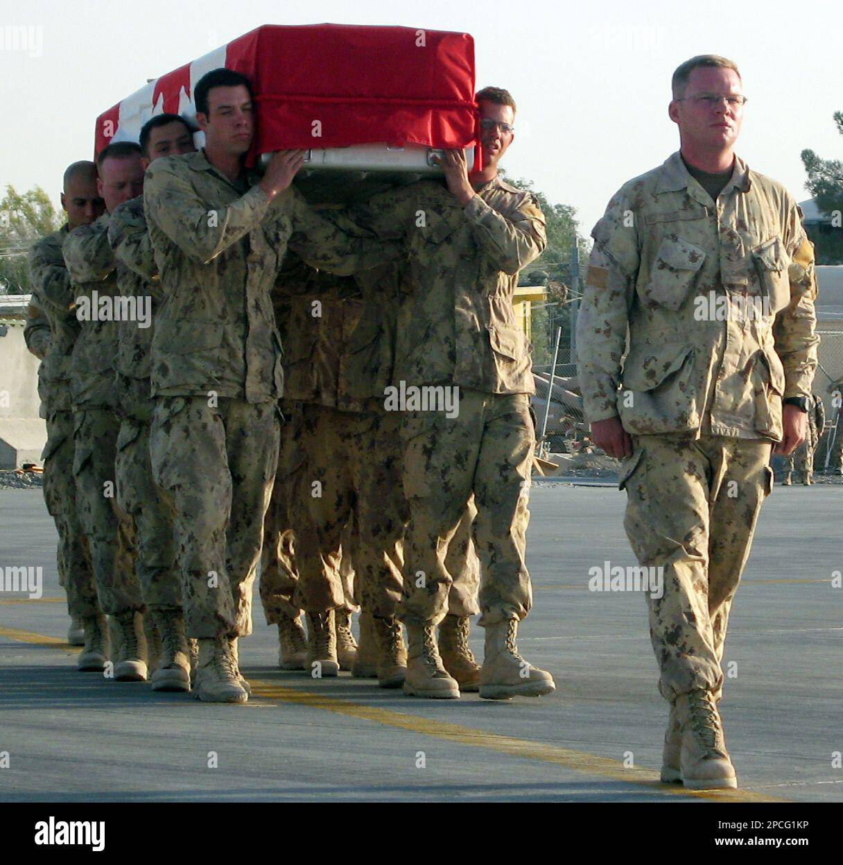 Canadian soldiers load the remains of Pte. Josh Klukie onto a Hercules ...