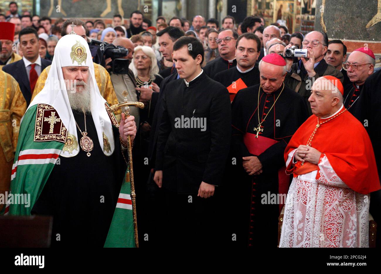 The Milan archbishop, Cardinal Dionigi Tettamanzi, right, looks at ...