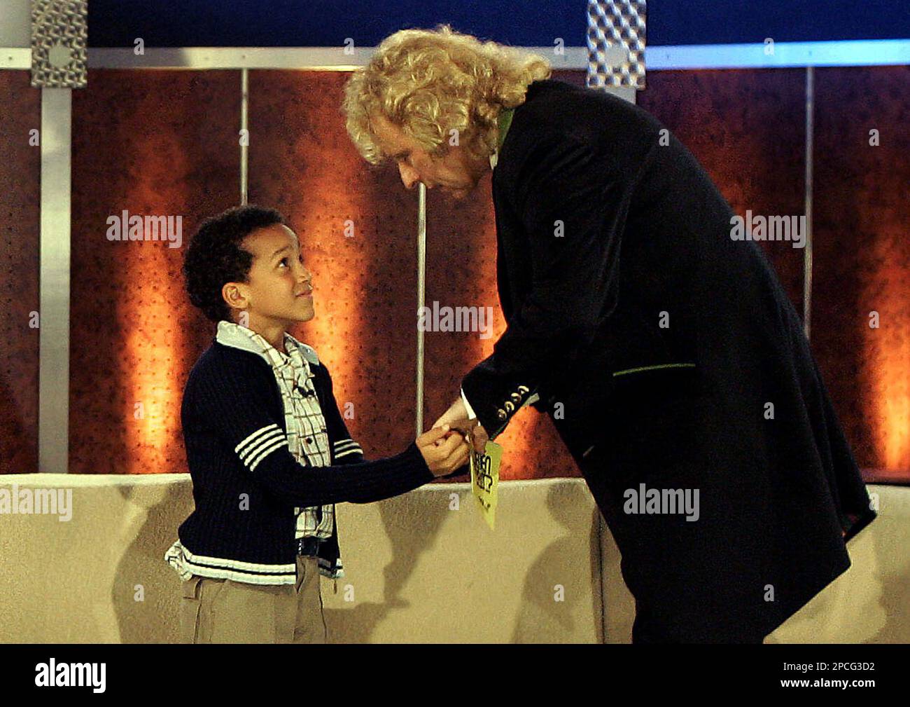 German TV presenter Thomas Gottschalk, right, talks with German child ...