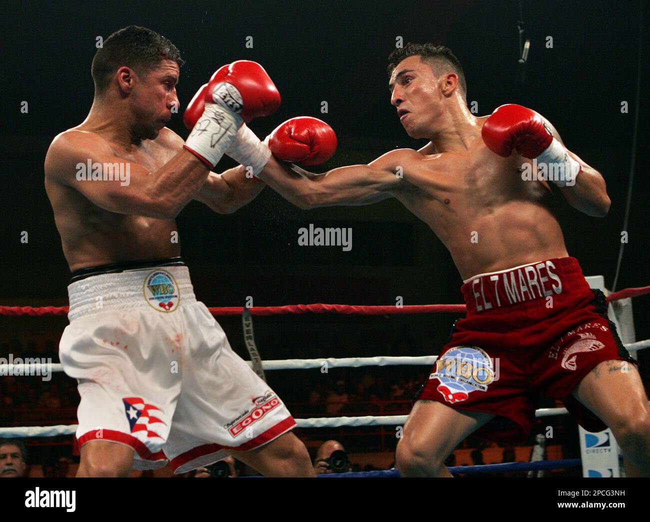 Mexican boxer Hugo Cazares, right, hits Puerto Rico's Nelson Dieppa ...