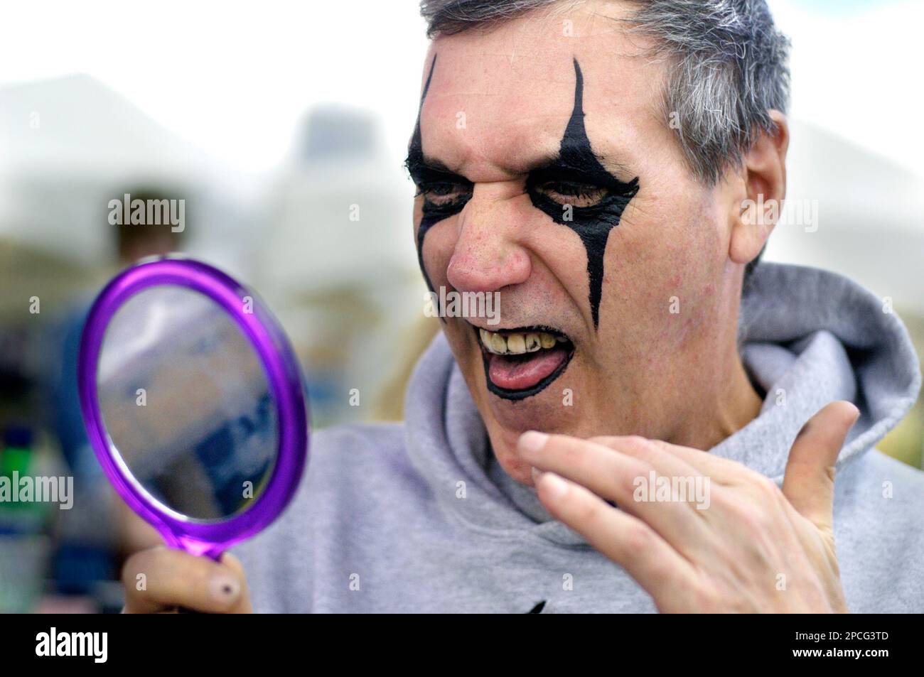 Don Faber makes a face while checking out his new look modeled after ...