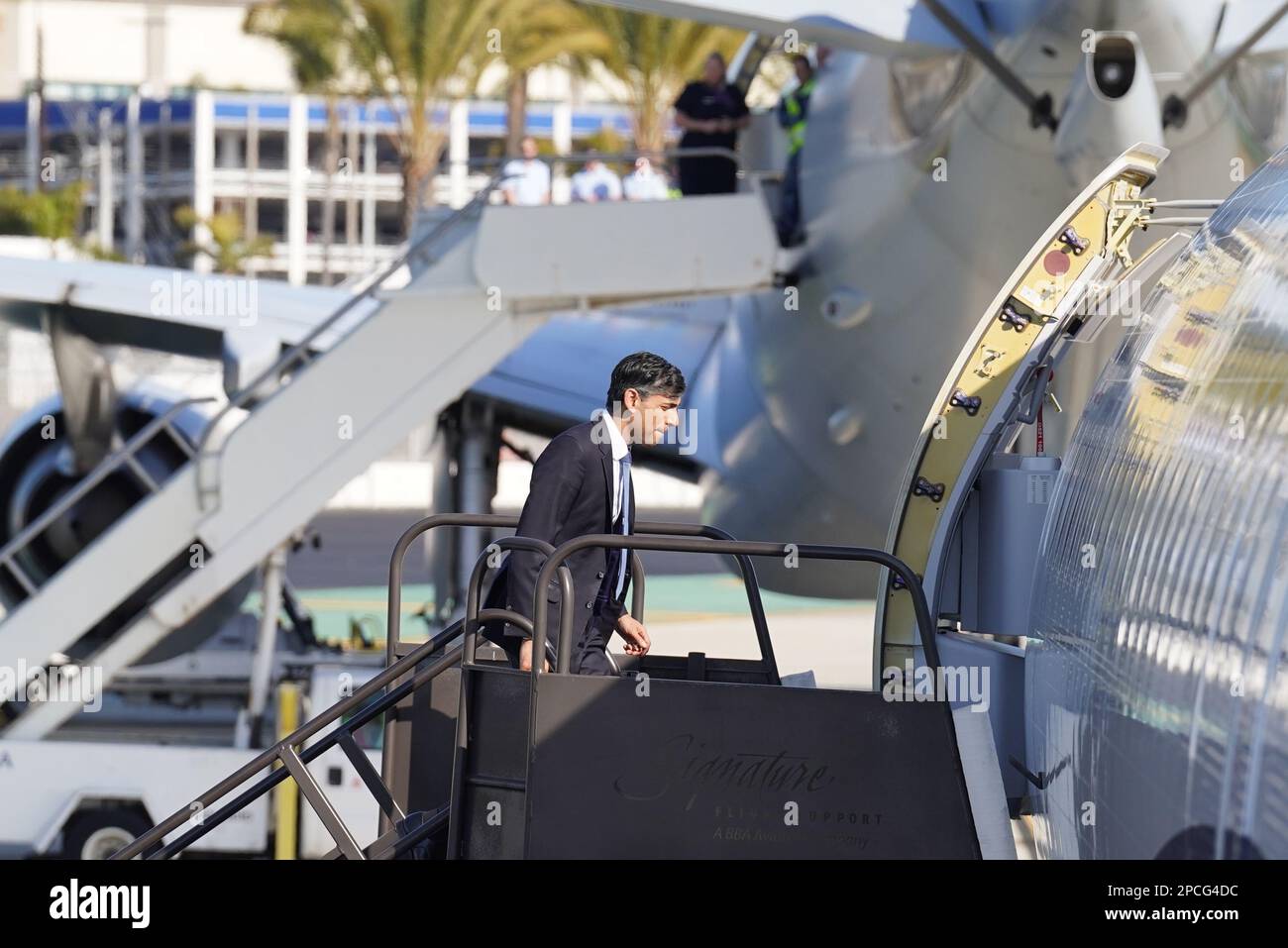 Prime Minister Rishi Sunak climbs the steps to his plane at San Diego ...
