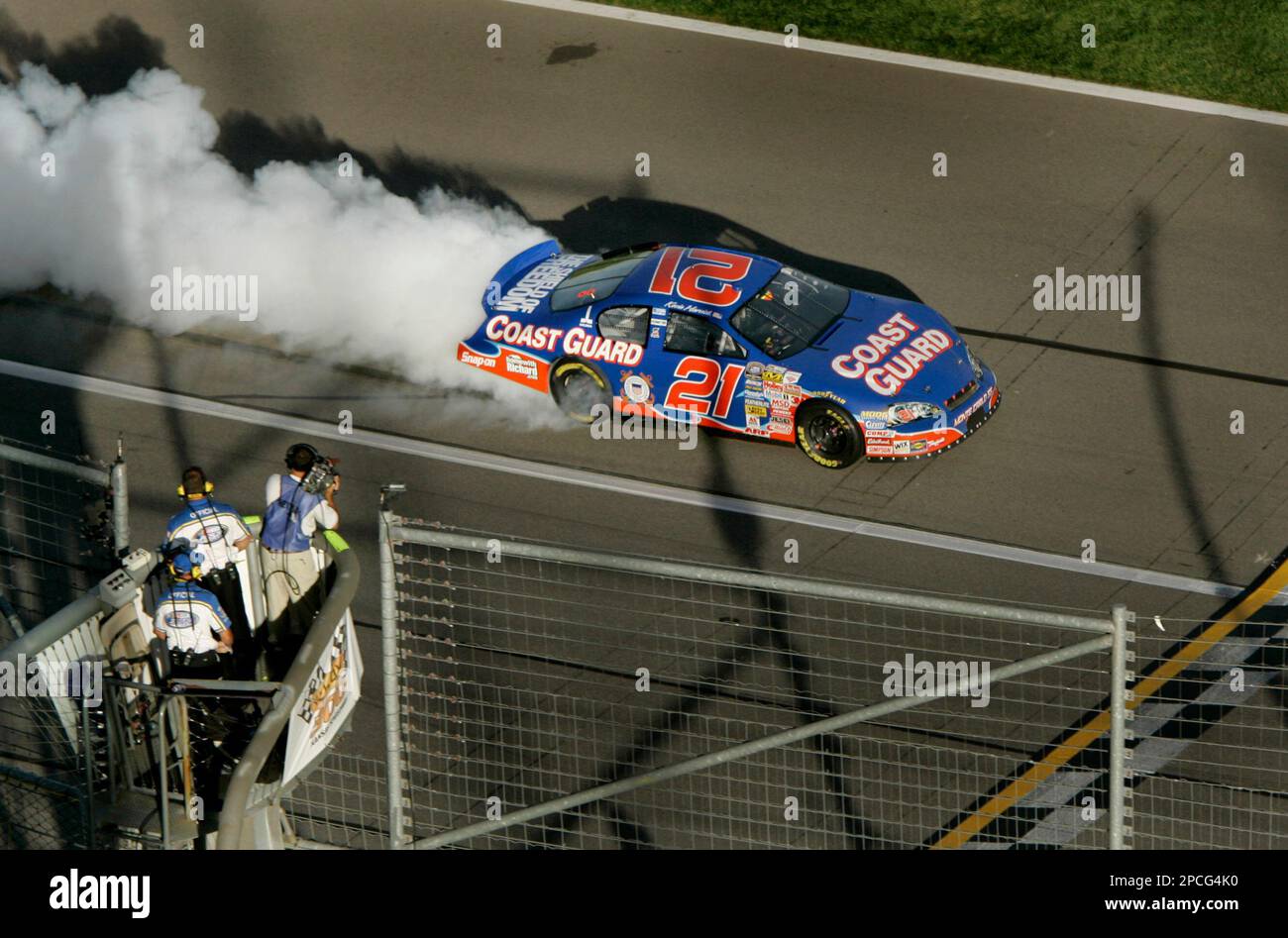 Kevin Harvick celebrates by spinning his tires after winning the Yellow ...