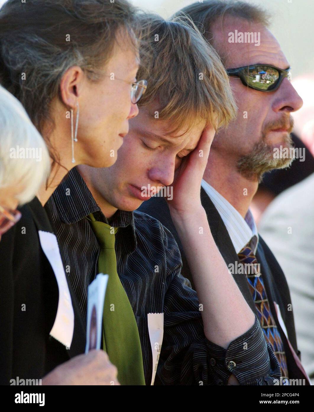 From left, Ellen Keyes, her son Casey, and husband John Michael look on ...