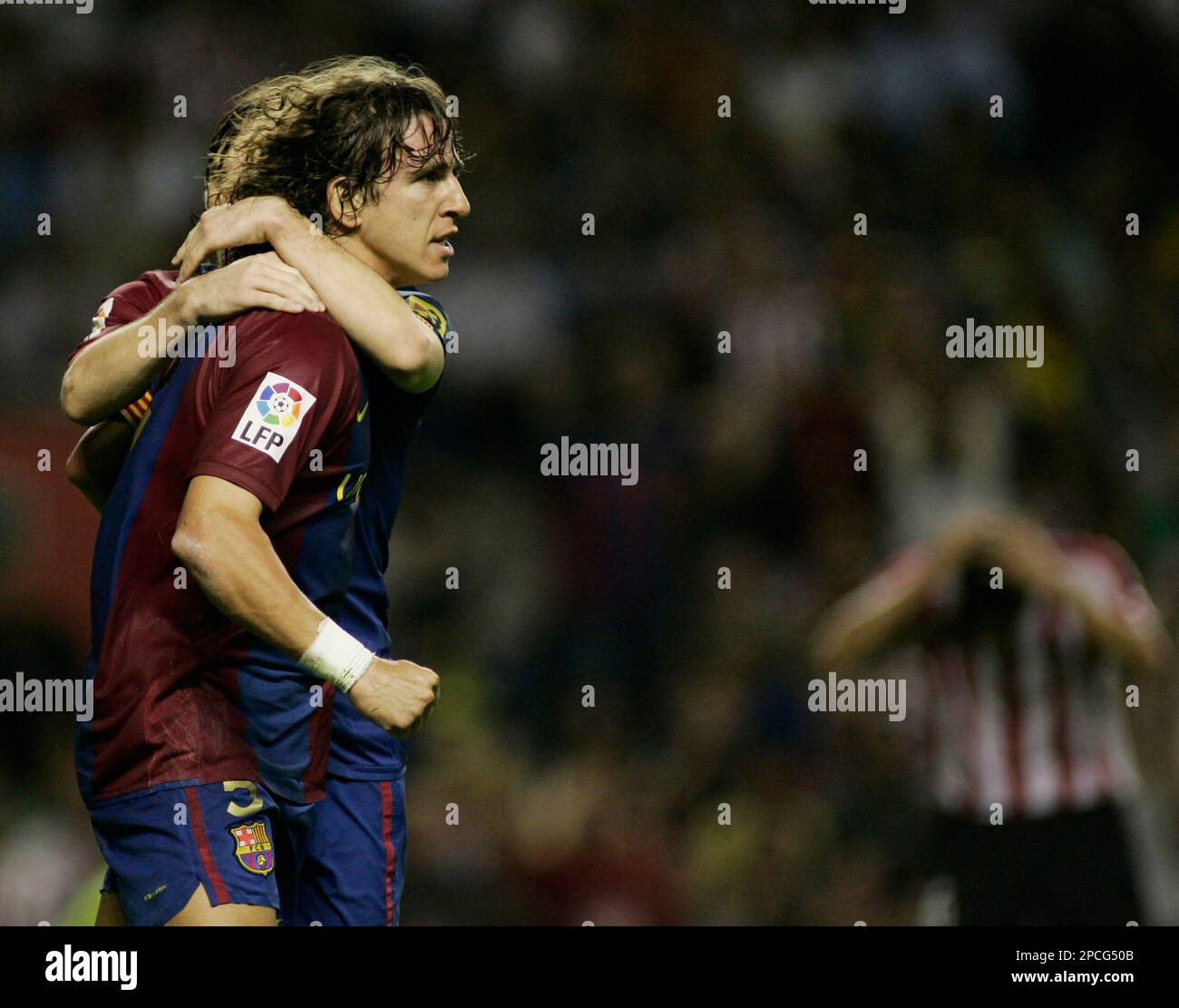 FC Barcelona players Carles Puyol, front, and Lionel Messi celebrate ...