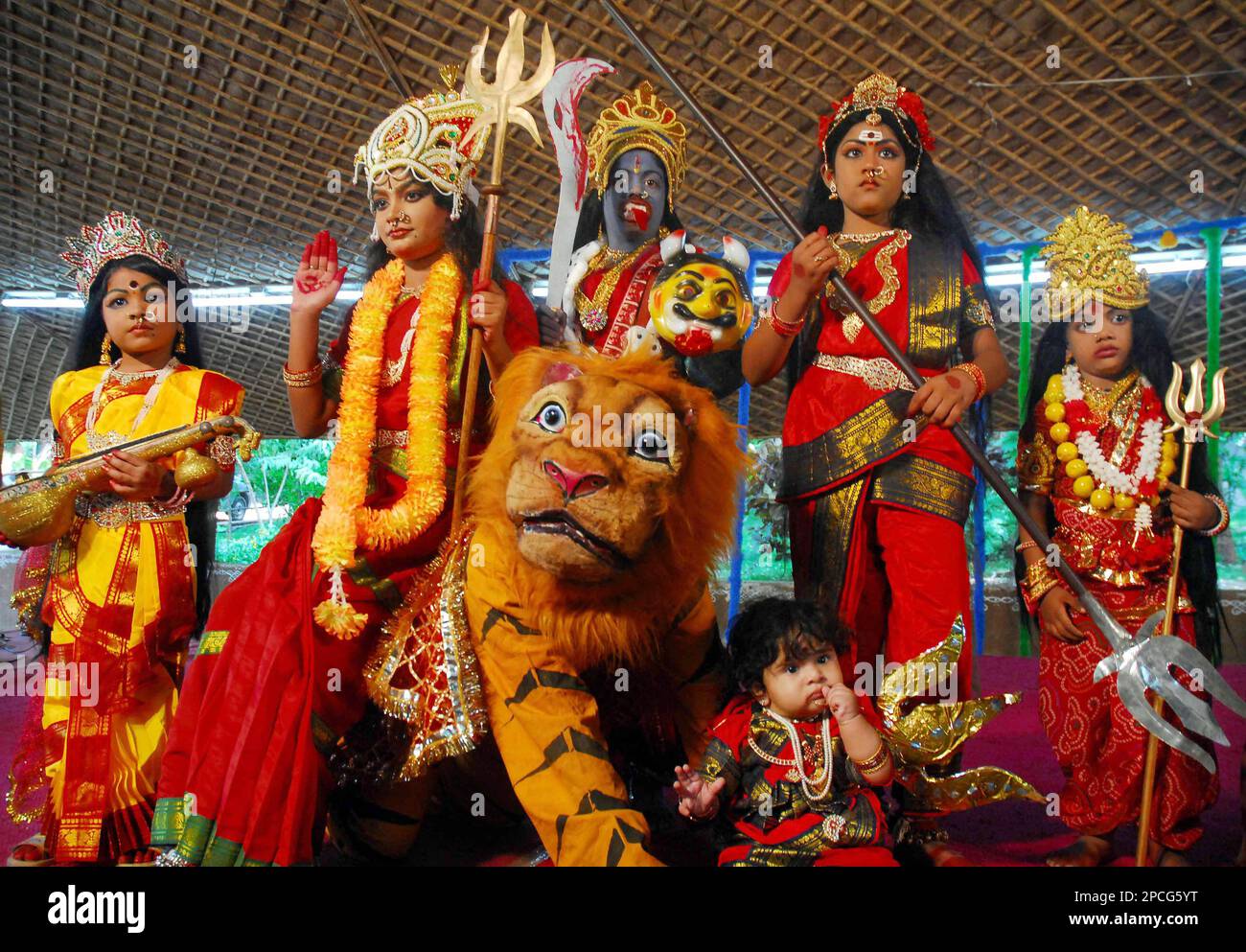Children dressed as Hindu Goddess Durga participate in a costume ...