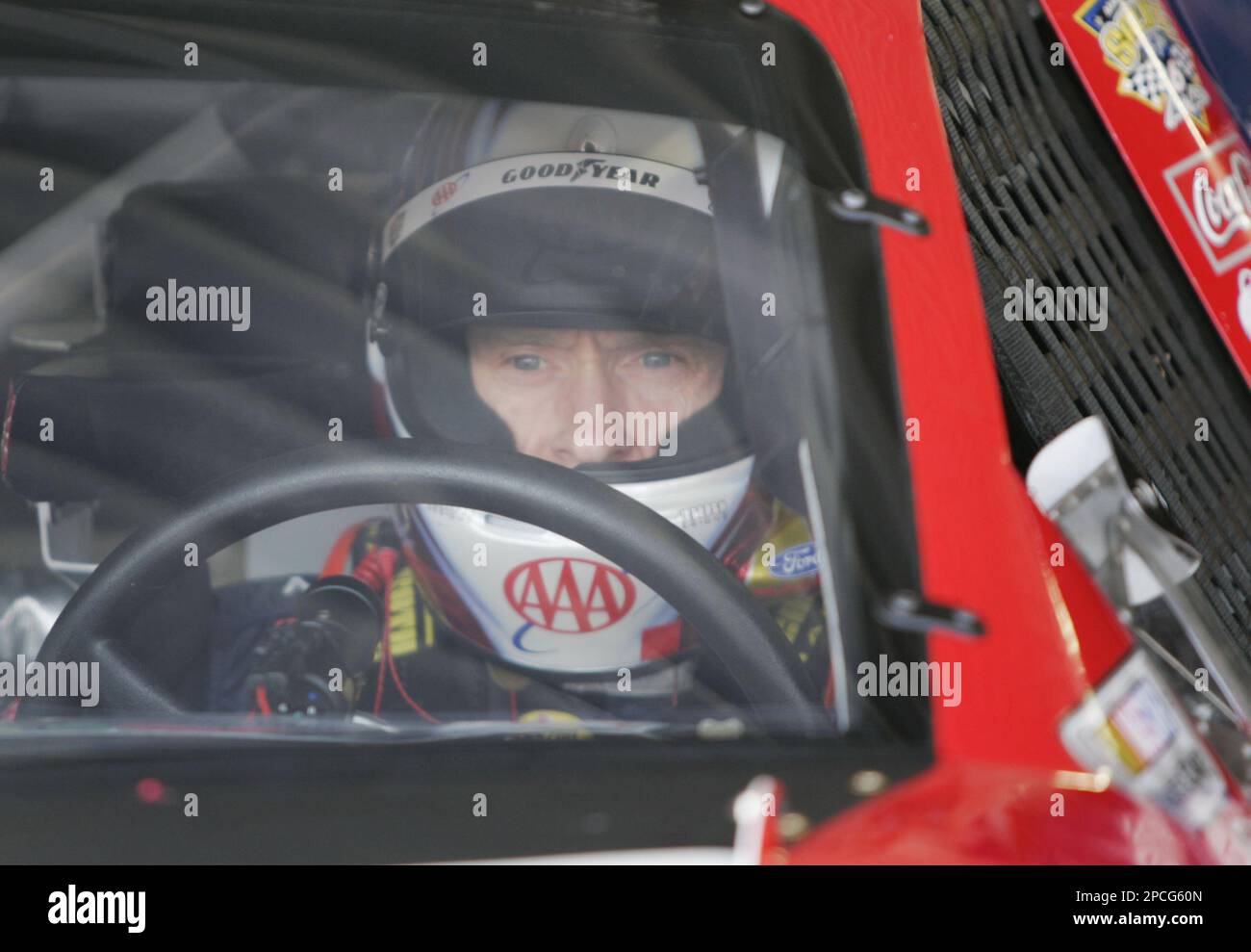 Mark Martin waits for Nextel Cup Series practice at Kansas Speedway in ...