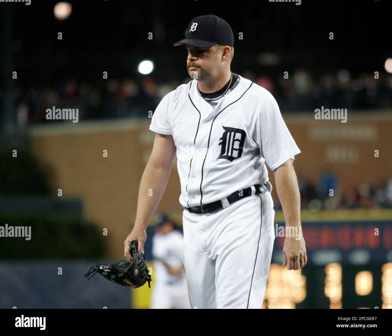 Detroit Tigers closer Todd Jones walks off the field after pitching the ...