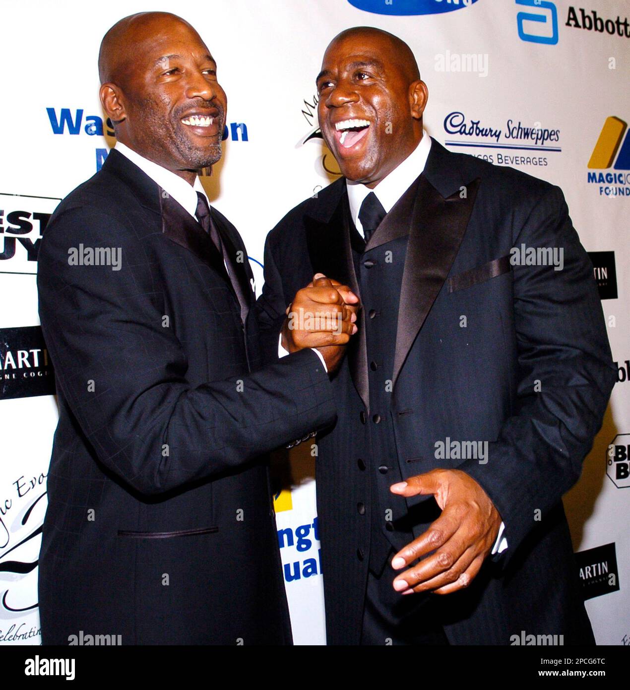 Former Los Angeles Lakers teammates James Worthy, left, and Earvin ...