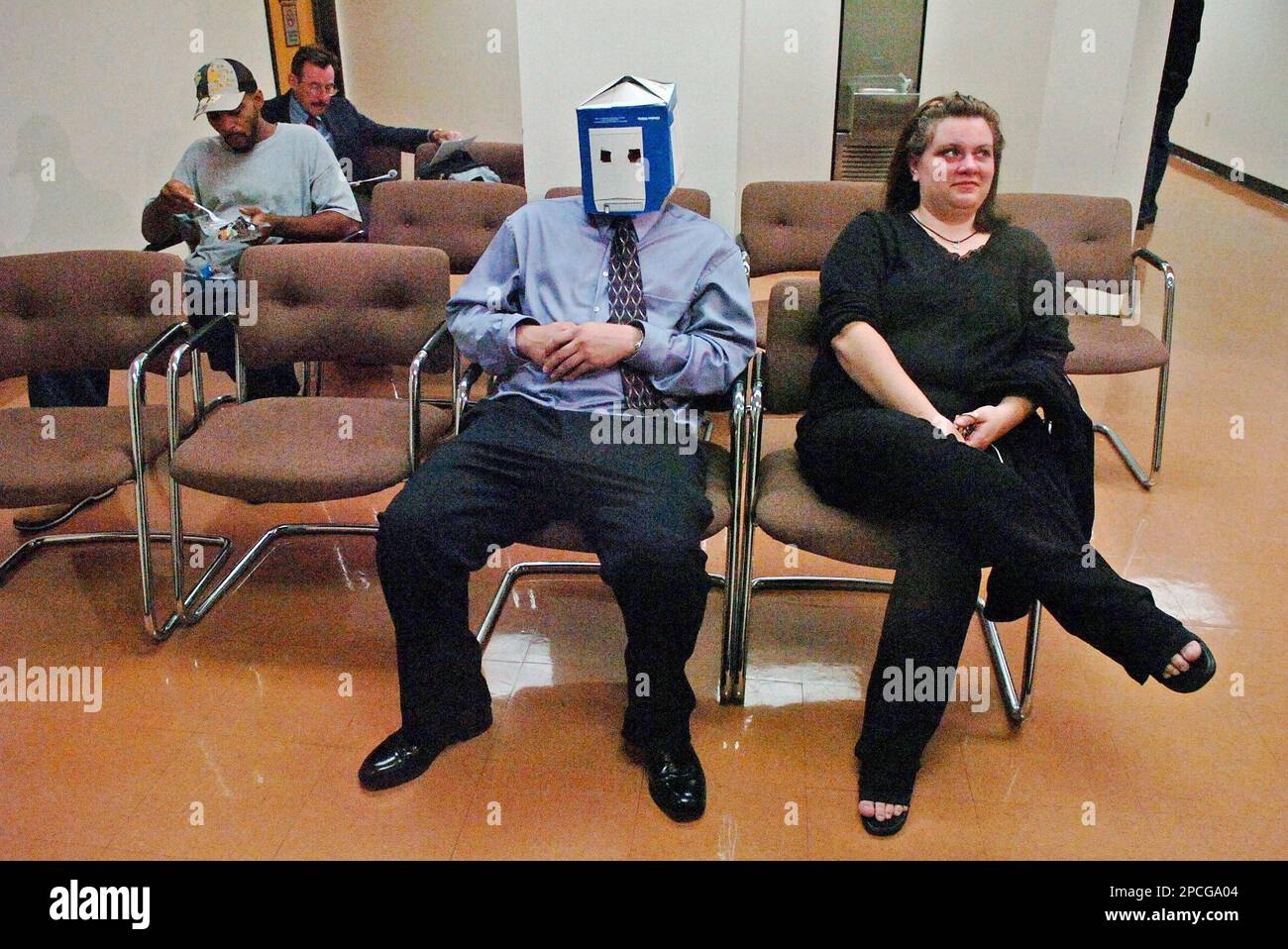 Defendant Justin Michael Kalich, of New Stanton, Pa. sits with a box on ...