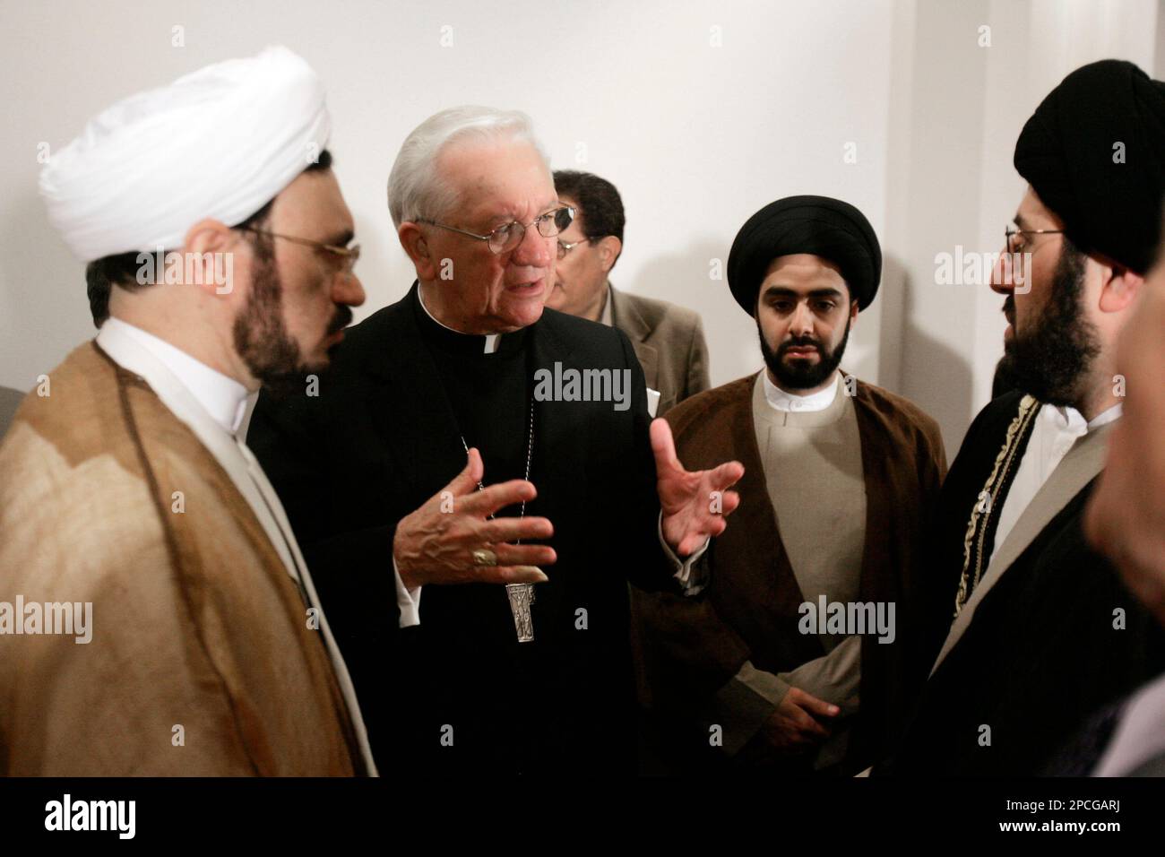 Cardinal Adam Maida, second from left, talks with Imam Mohamad Ali ...