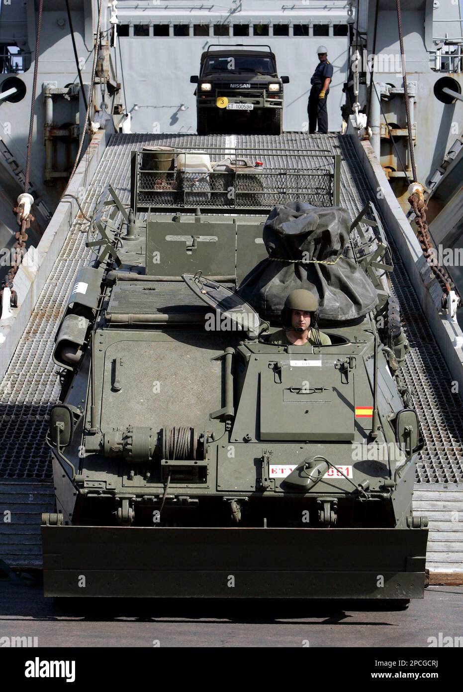 A Spanish U.N. peacekeeper drives an armored personnel carrier as he ...
