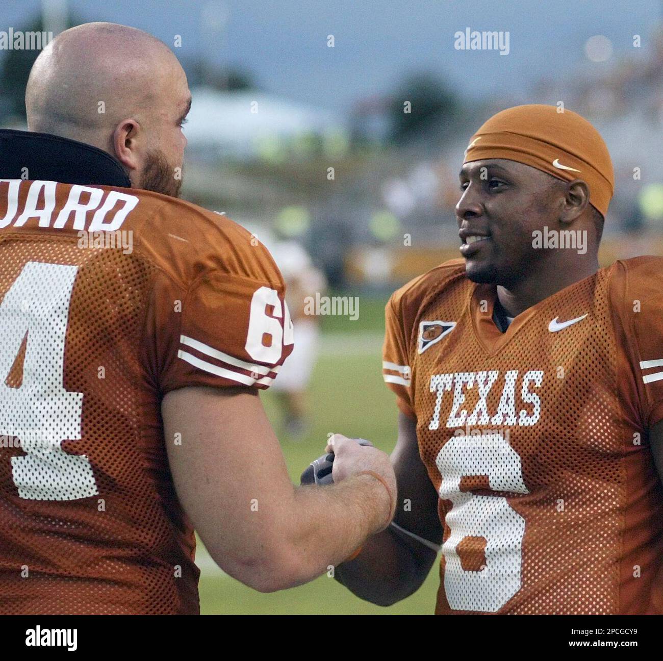 Texas wide receiver Quan Cosby, right, and offensive guard Kasey ...