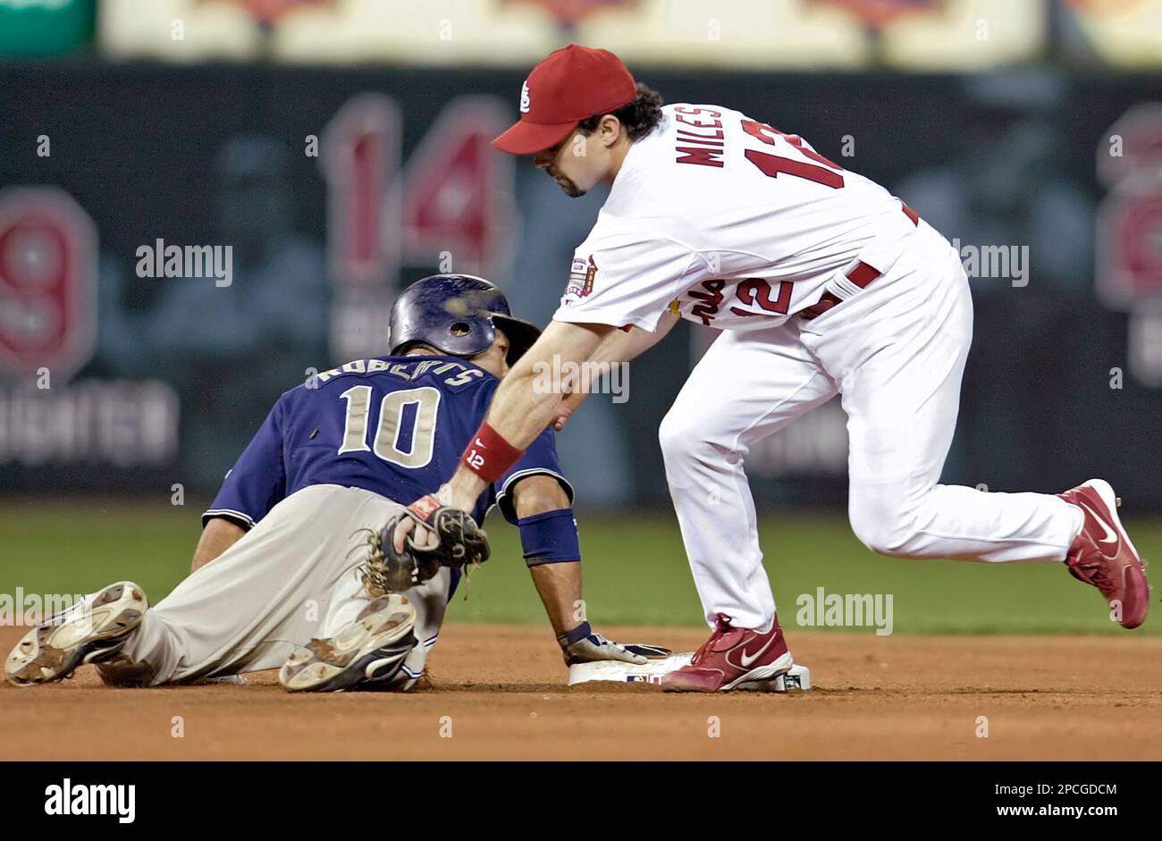 St. Louis Cardinals' Aaron Miles applies the late tag as San Diego ...