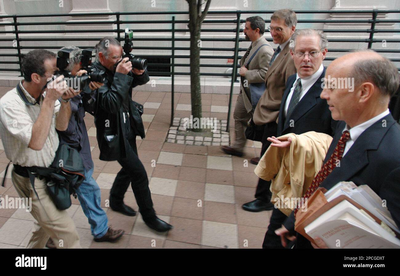 E. Forbes Smiley III, second from right, looks to his attorney Richard ...