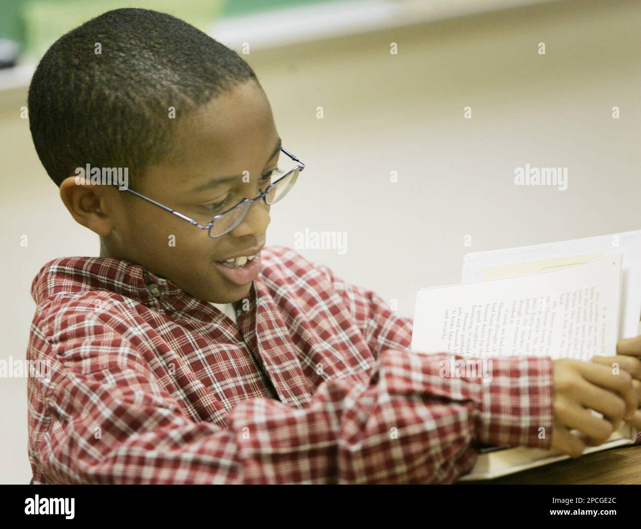 Fourth-grader Kevin Giles reads while in class at Ware Elementary ...