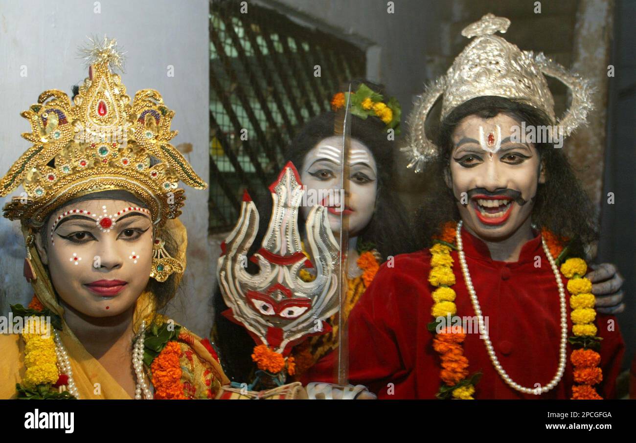 Children dressed in costumes depicting Hindu God Shiva, center, Goddess ...