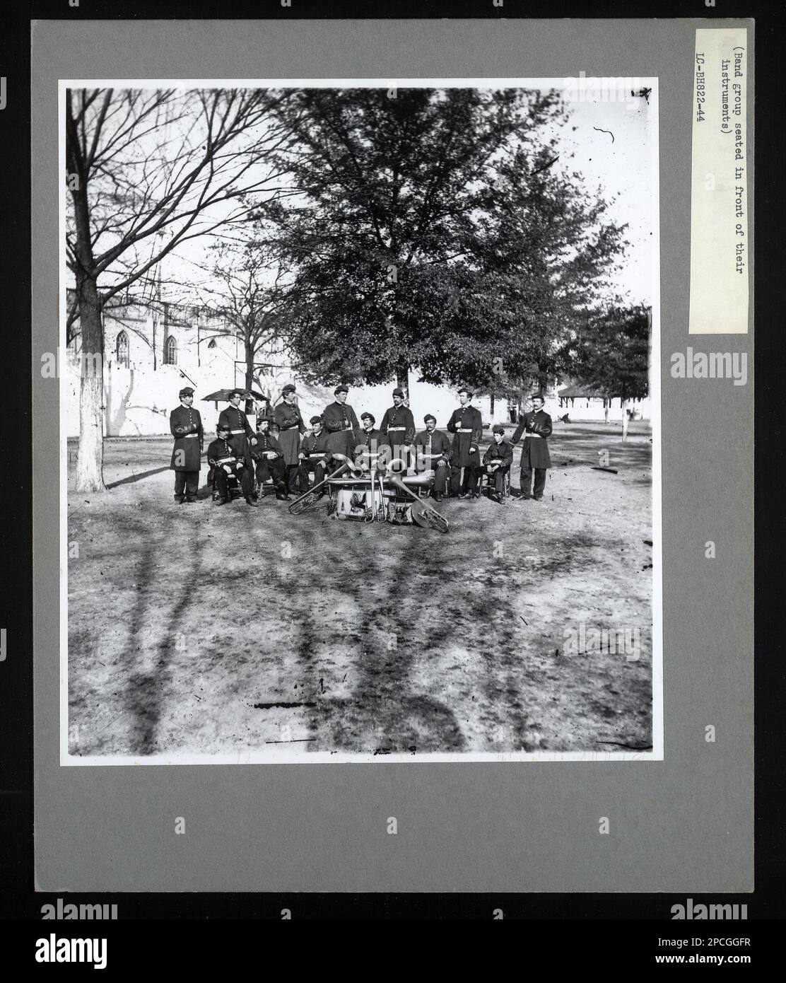 Band group seated behind their instruments. Print made by Library of ...