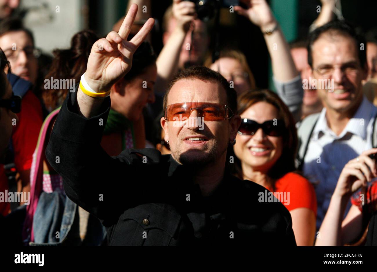 Bono of the rock band U2 greets fans after a book signing for their ...