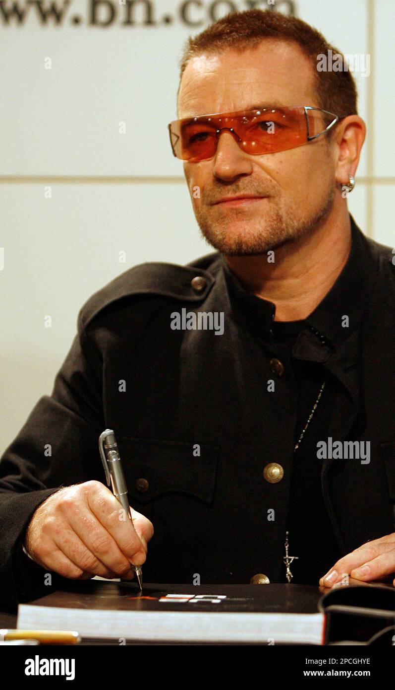 Bono of the band U2 signs copies of the new book "U2 by U2" Tuesday ...