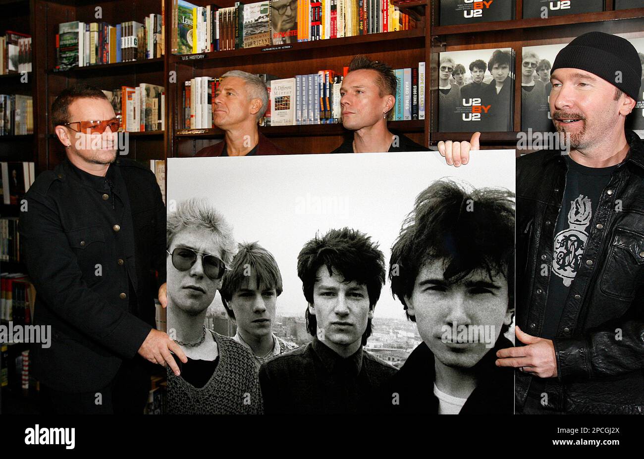 The rock band U2, left to right, Bono, Adam Clayton, Larry Mullen Jr ...