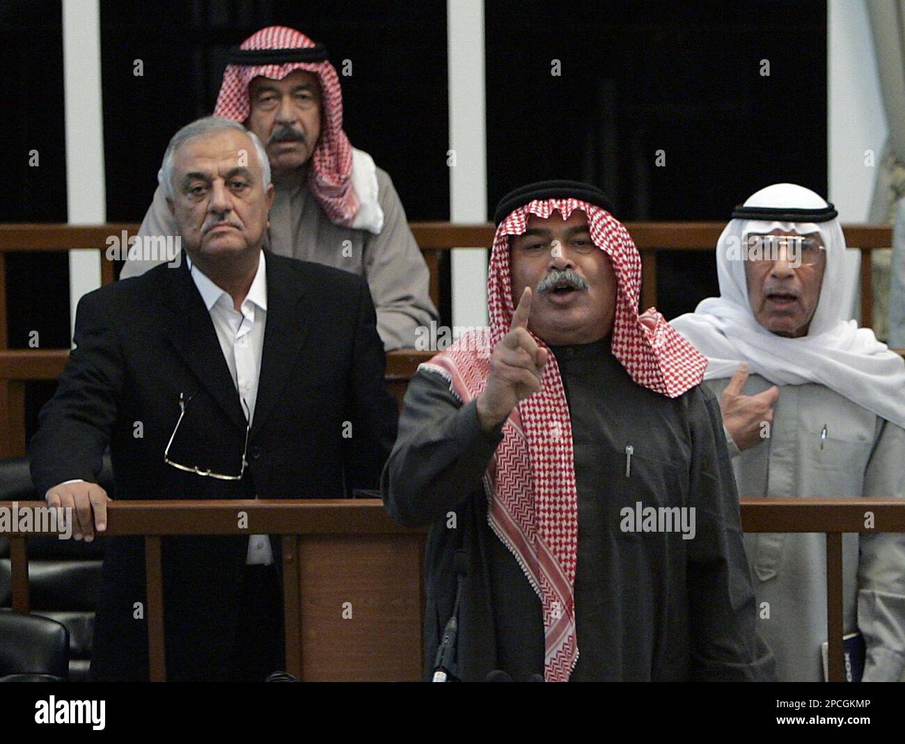 Defendants Sultan Hashim Ahmad al-Tai, center right, Sabir al-Douri ...