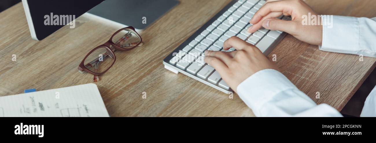 Close up of business woman hands working using keyboard of computer in ...
