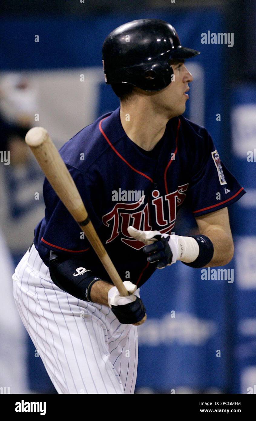 Minnesota Twins' Joe Mauer watches his RBI single off Kansas City ...