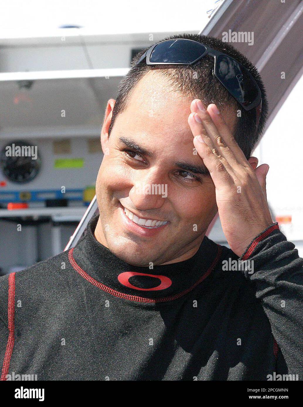 Juan Pablo Montoya of Colombia smiles at Talladega Superspeedway after ...