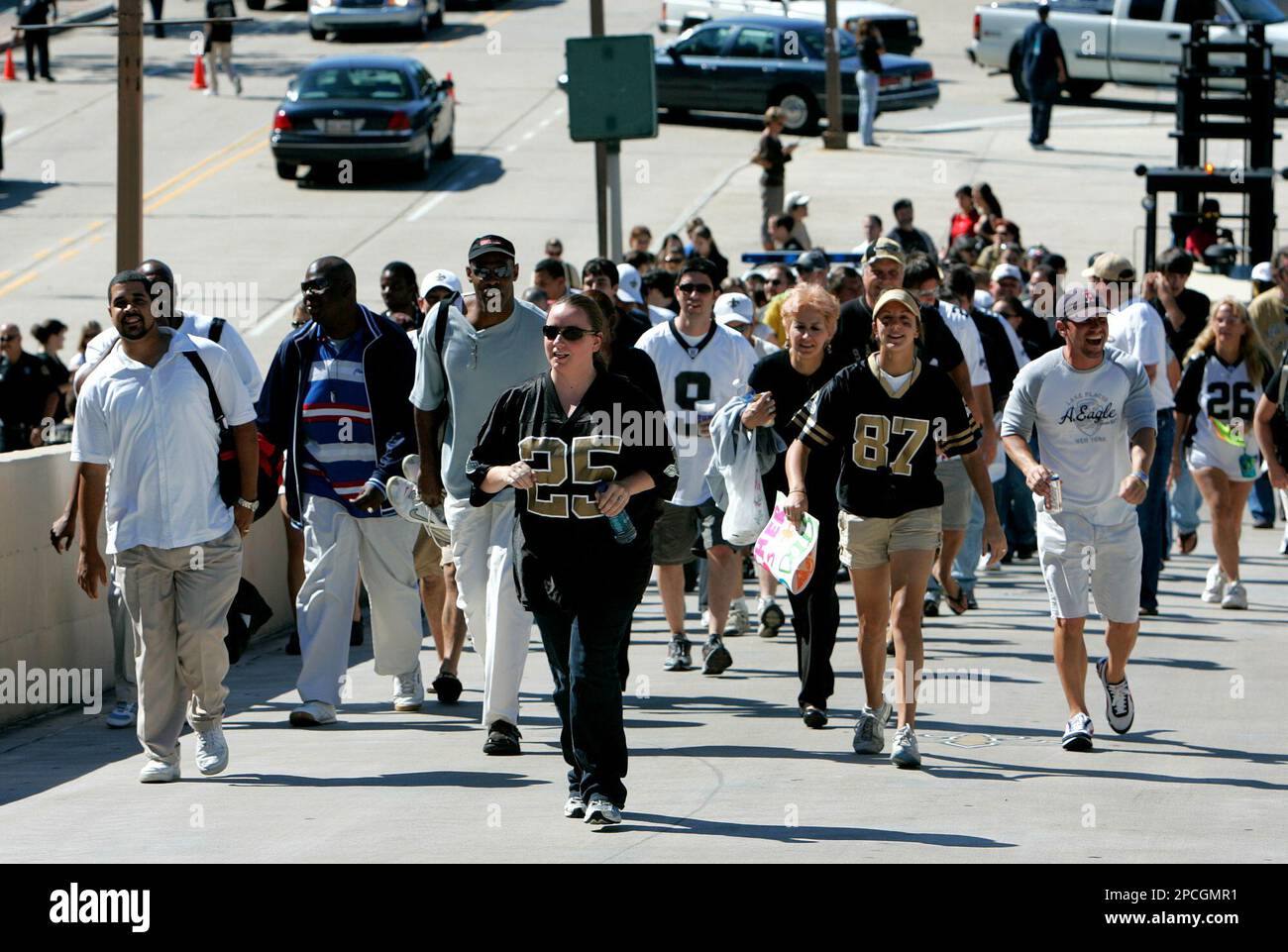 New Orleans Saints fans walk up the ramps in front of the Louisiana ...