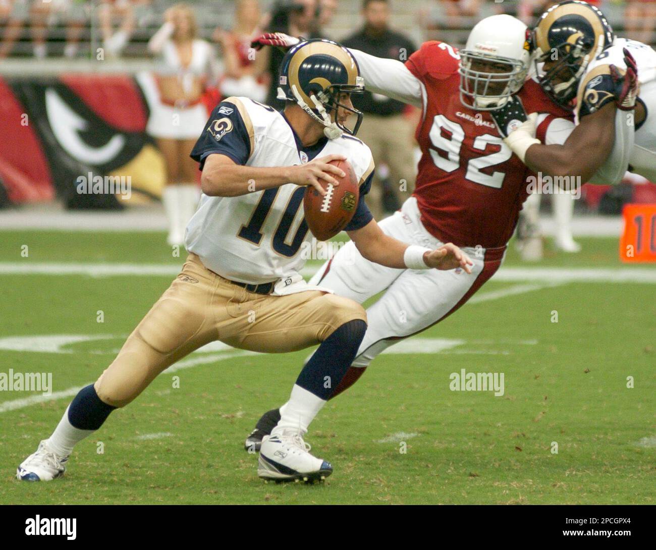 St. Louis Rams quarterback Marc Bulger (10) scrambles as Arizona ...