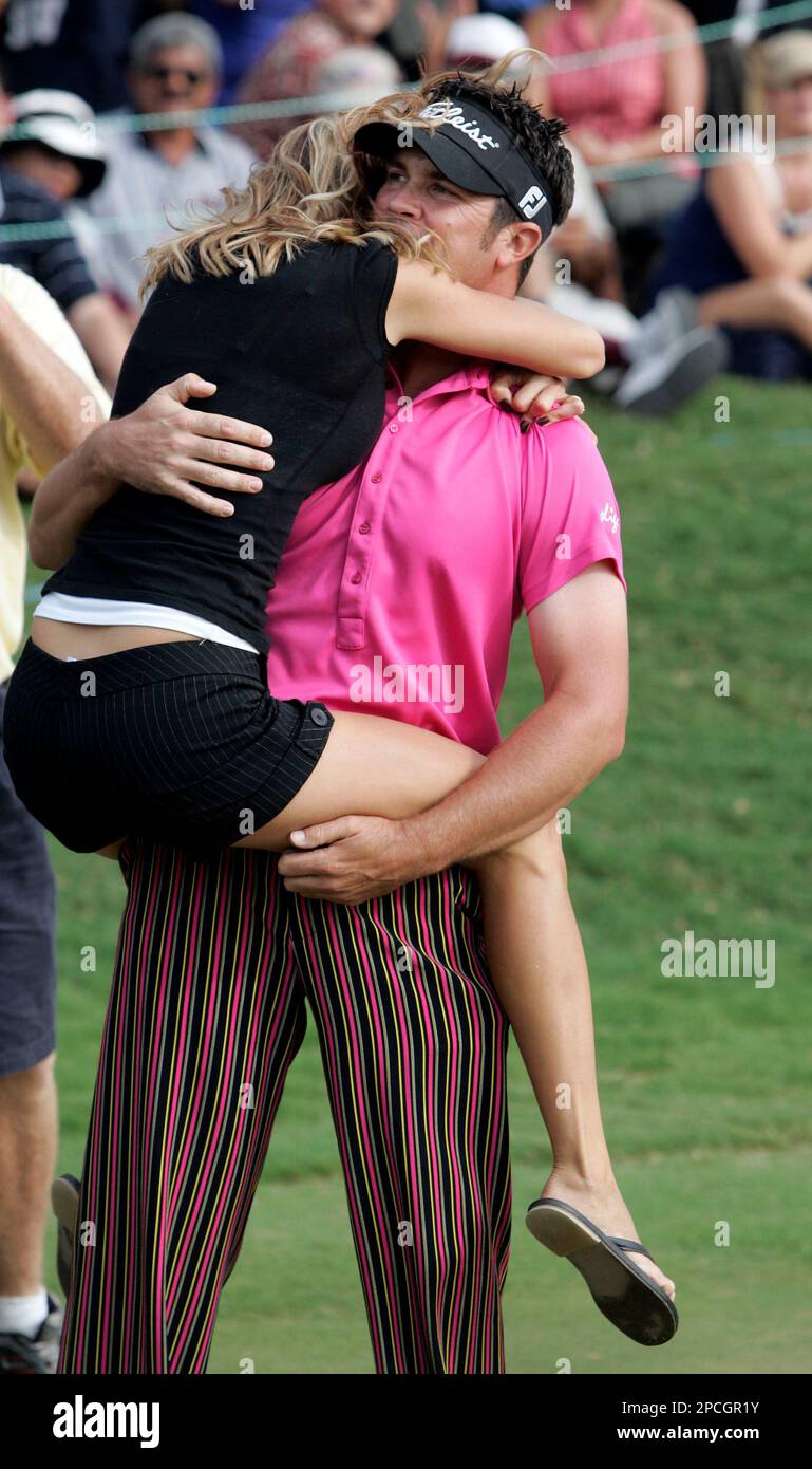 Eric Axley, of Knoxville, Tenn., is embraced by his wife, Cortney Axley ...