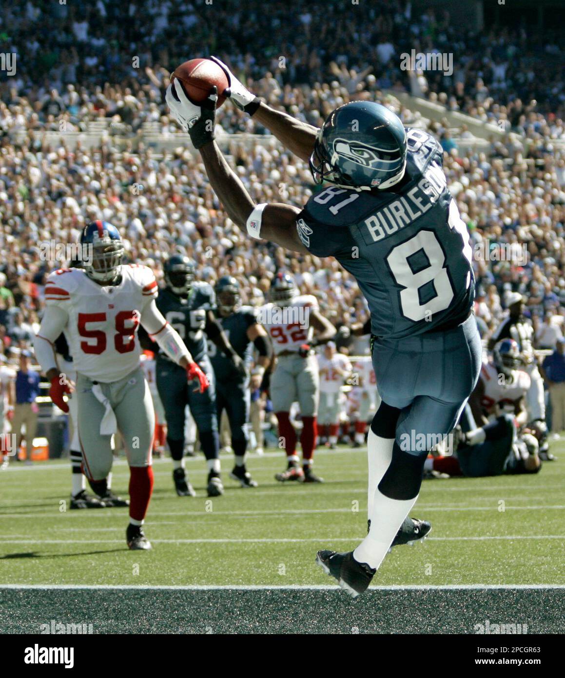 Seattle Seahawks wide receiver Nate Burleson catches a pass for a ...