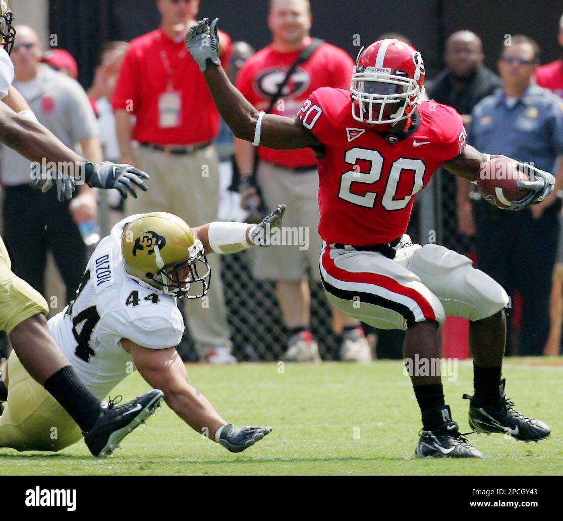 Georgia tailback Thomas Brown (20) gets by Colorado linebacker Jordon ...