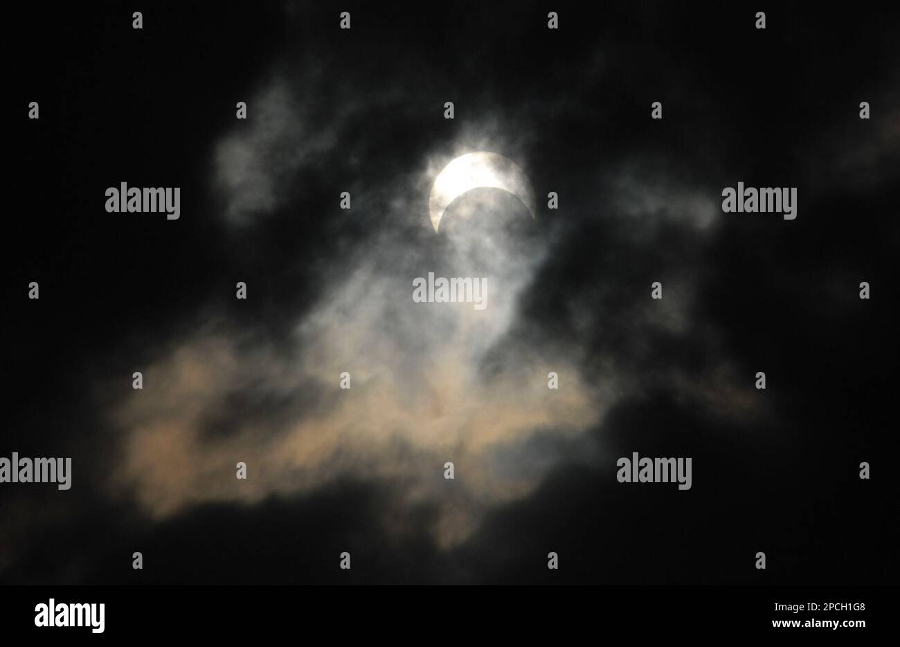 A partial solar eclipse is seen from the northern Amazon city of Belem ...