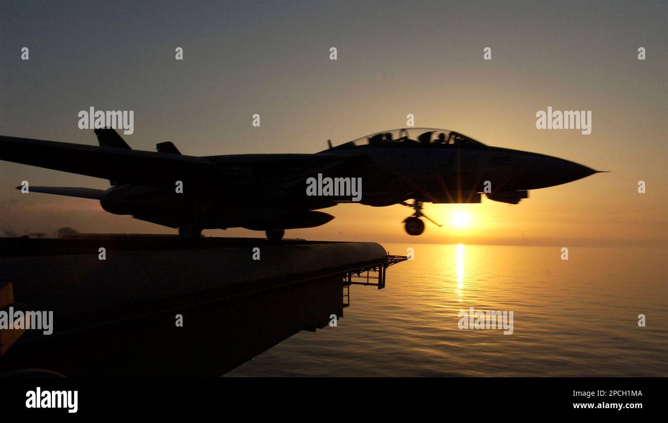 ** FILE ** An F-14A Tomcat is launched from the flight deck of the ...