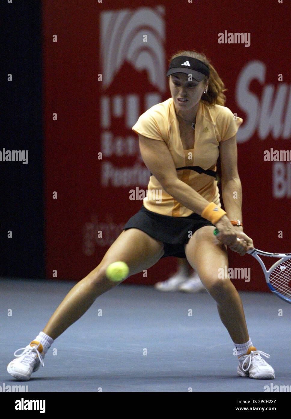 Martina Hingis of Switzerland plays against Tamarine Tanasugarn of ...