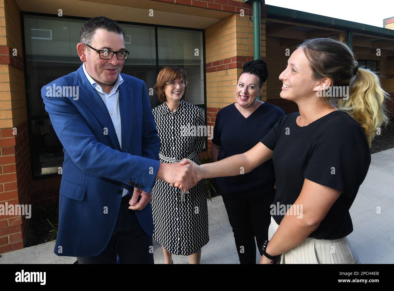 Victorian Premier Daniel Andrews (left) shakes hands with nurse unit ...