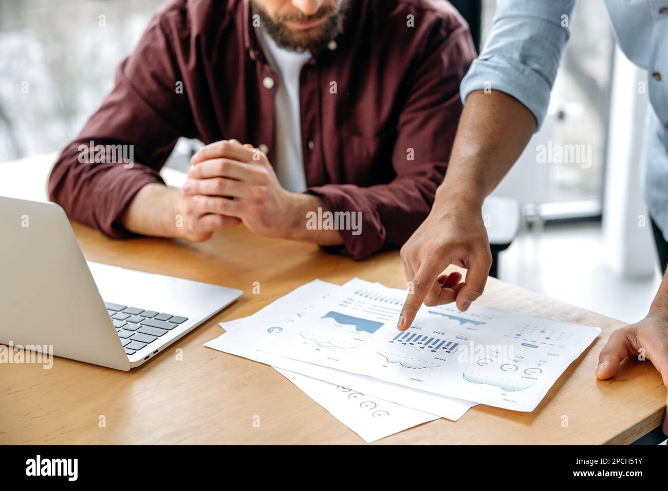 Analyzing current business charts hi-res stock photography and images ...