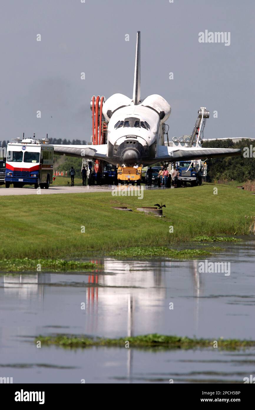 The Space Shuttle Atlantis is towed to the Orbiter Processing Facility ...